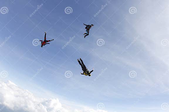 Three Skydivers are in the Blue Sky. Stock Photo - Image of moving ...