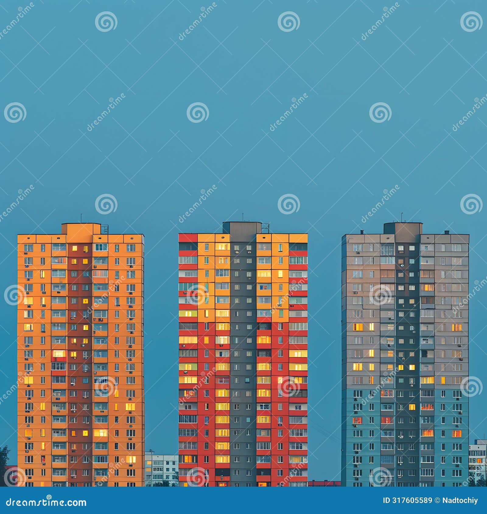 Three Skyscrapers Stand Tall in a Row Under a Clear Blue Sky Stock ...