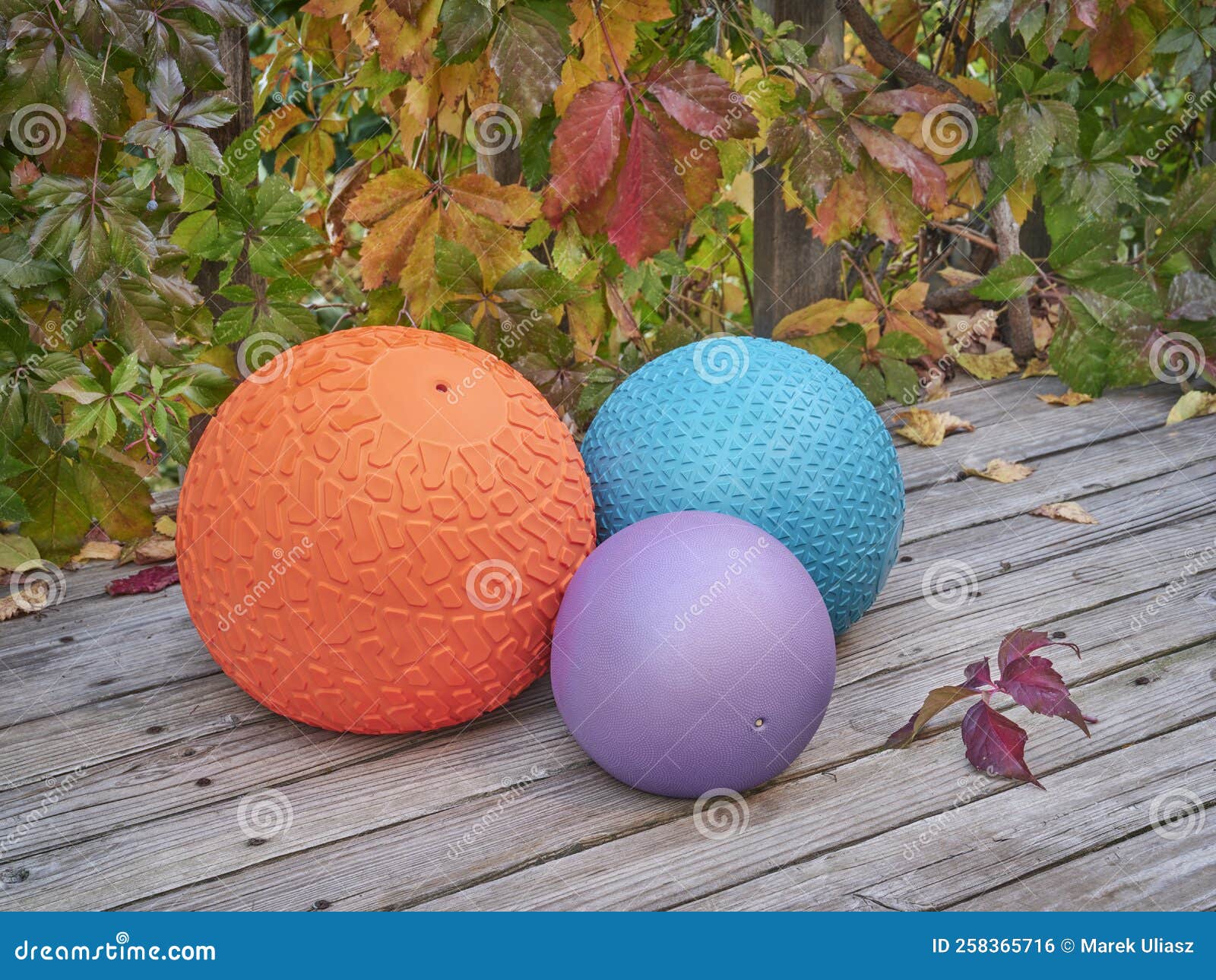 Three Slam Balls on a Backyard Deck Stock Photo - Image of colors, fall ...