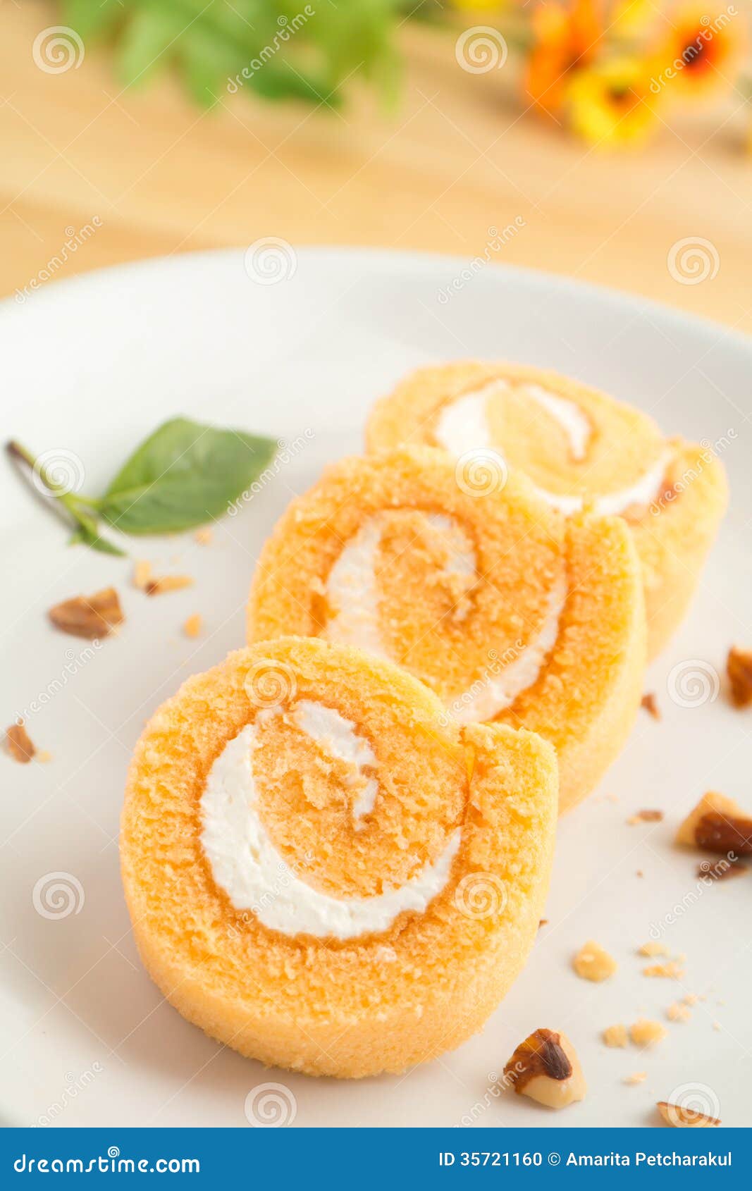 Three Slices of Orange Roll Cake Stock Photo - Image of calorie ...