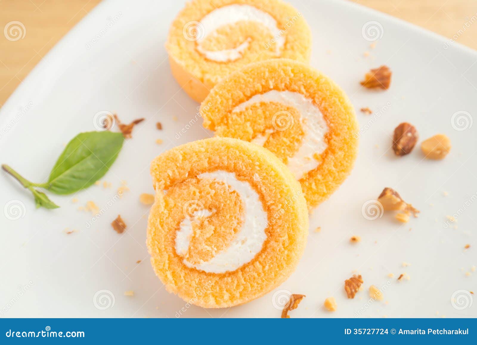Three Slices of Orange Roll Cake Stock Photo - Image of piece, sweet ...