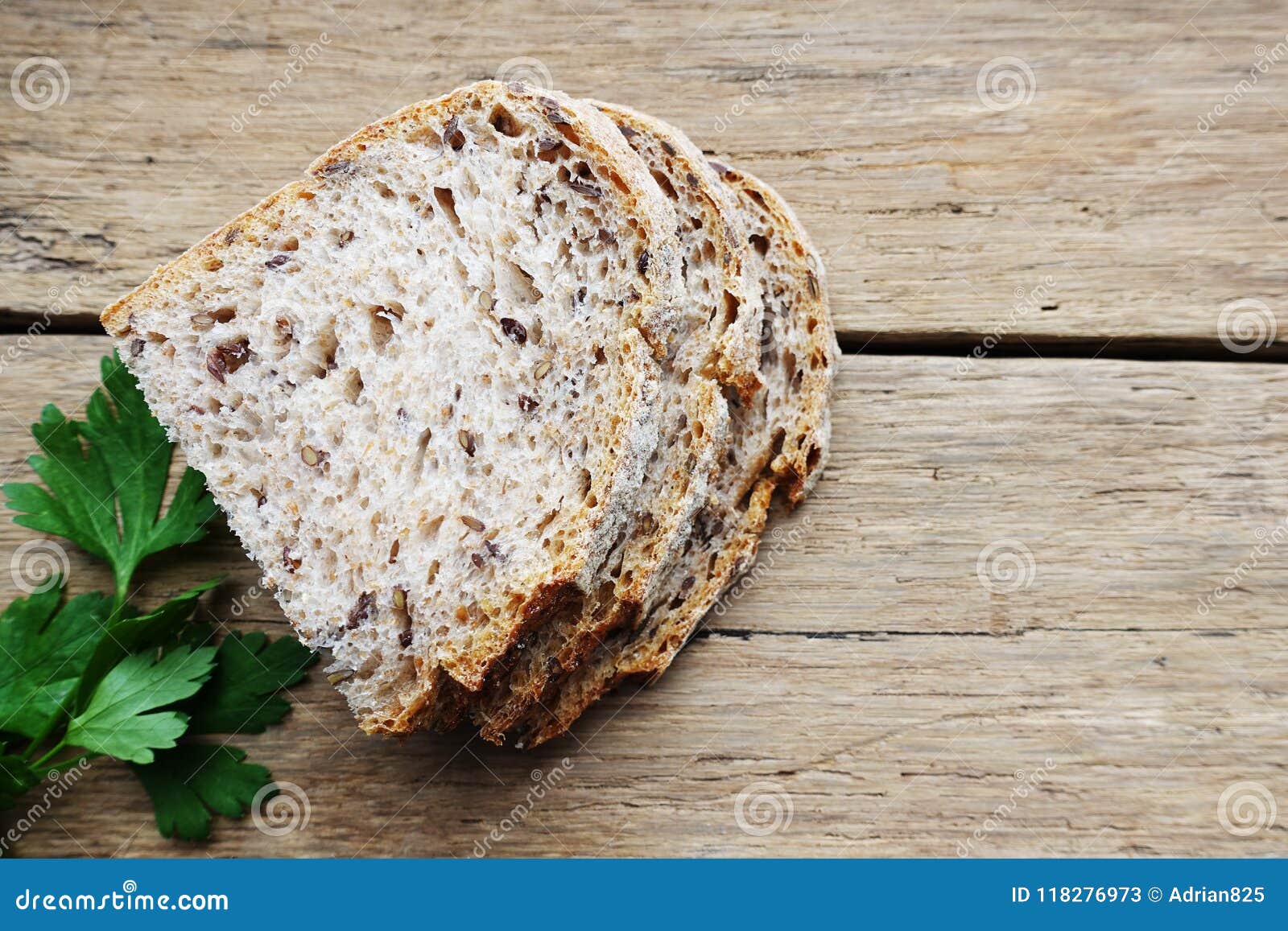 Slices of Rustic Bread with Seeds Isolated on Wooden Table or ...