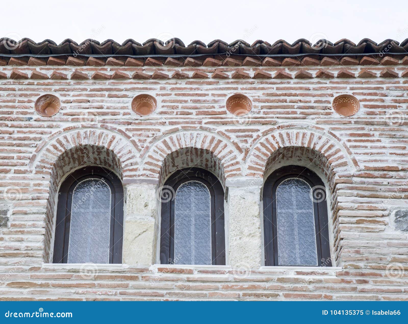 Three Small Arch Windows on a Brick Wall Stock Image - Image of glass ...