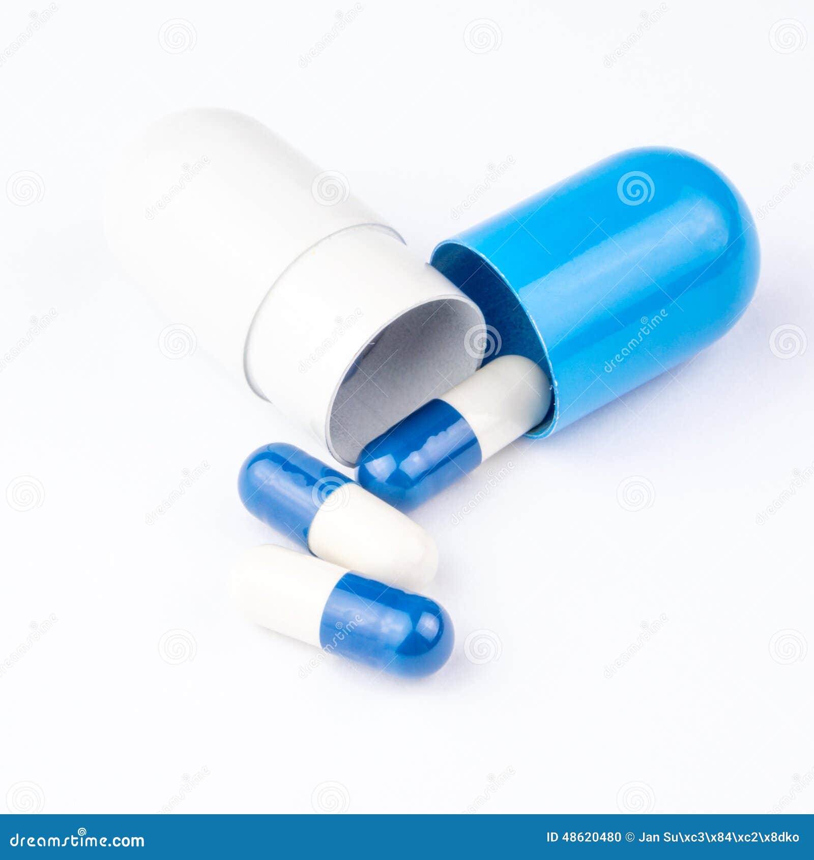 Three Small Pills are Coming Out from Big Blue and White Capsule Stock ...