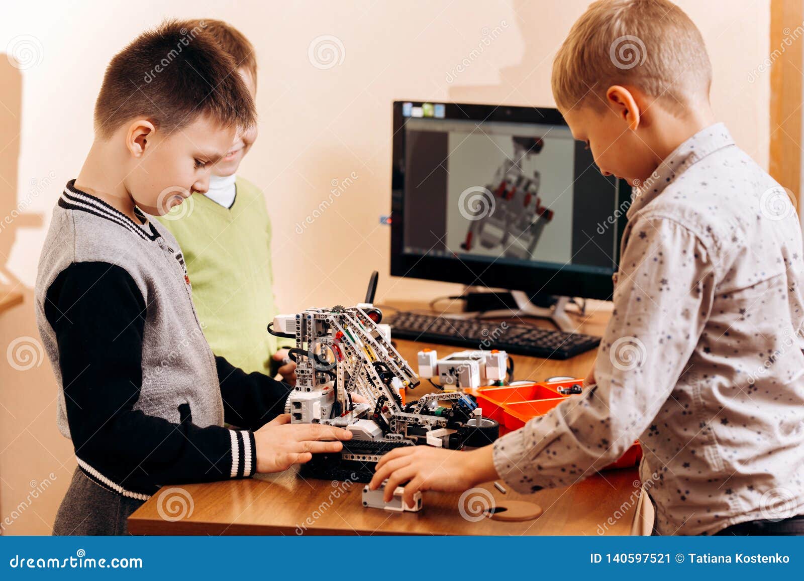 Three Smart Boys are Making Robots from the Robotic Constructor at the ...