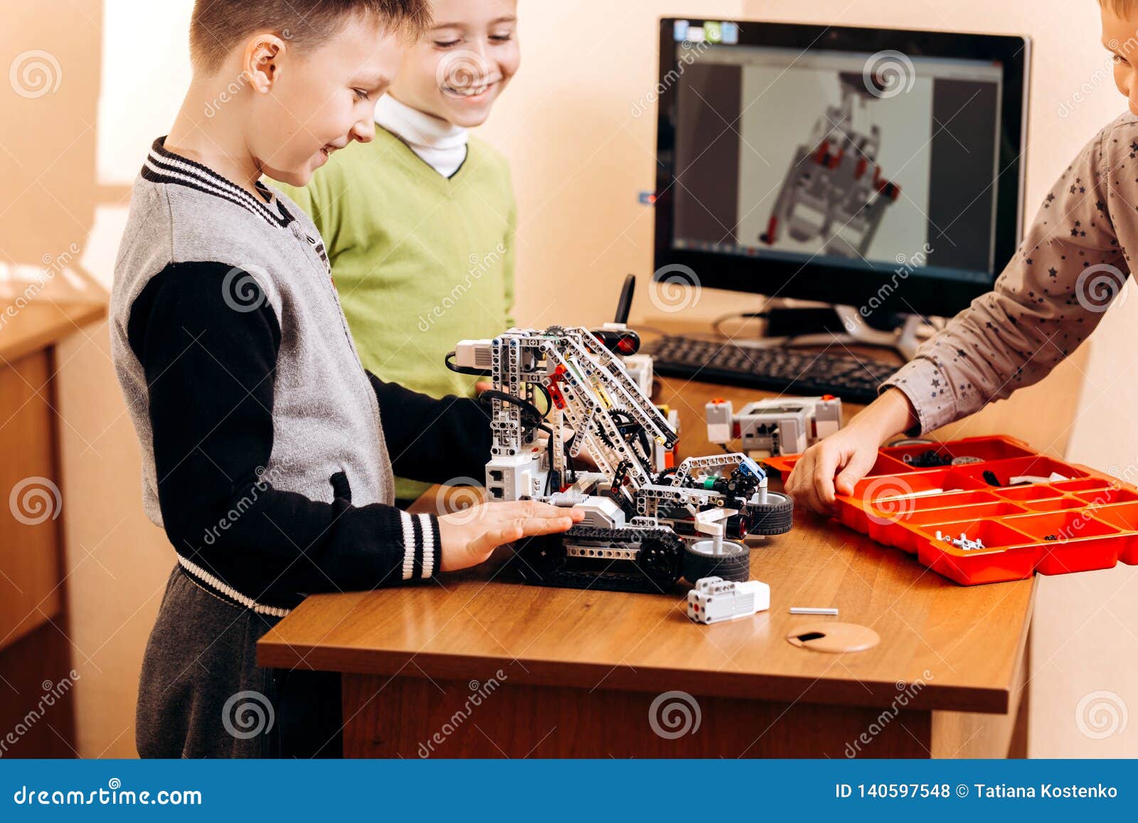 Three Smart Boys are Making Robots from the Robotic Constructor at the ...