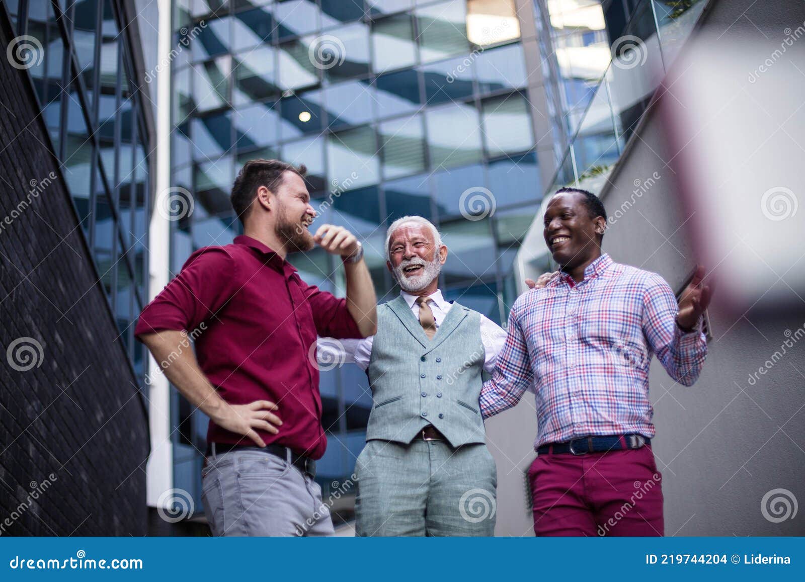 Three Smiling Business Men Talking Stock Photo - Image of mature ...