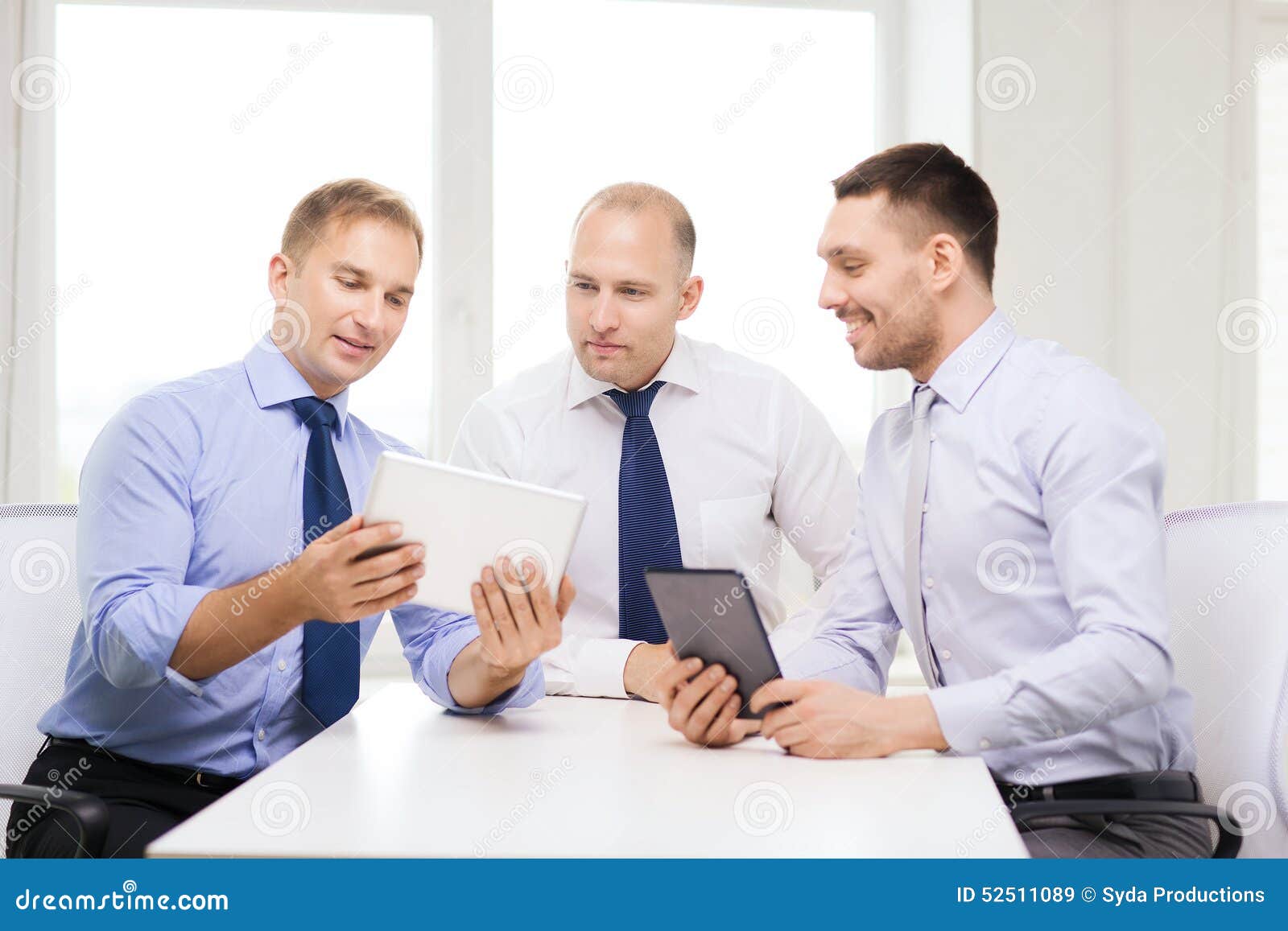 Three Smiling Businessmen with Tablet Pc in Office Stock Image - Image ...