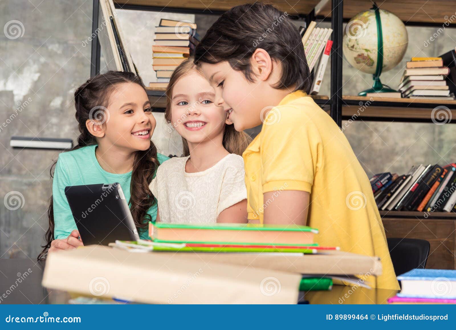 Three Smiling Children Using Digital Tablet Stock Photo - Image of ...