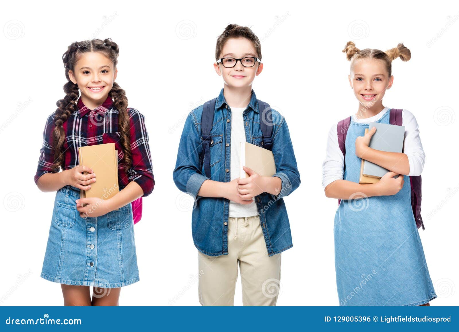 Three Smiling Classmates Holding Books and Looking at Camera Stock ...