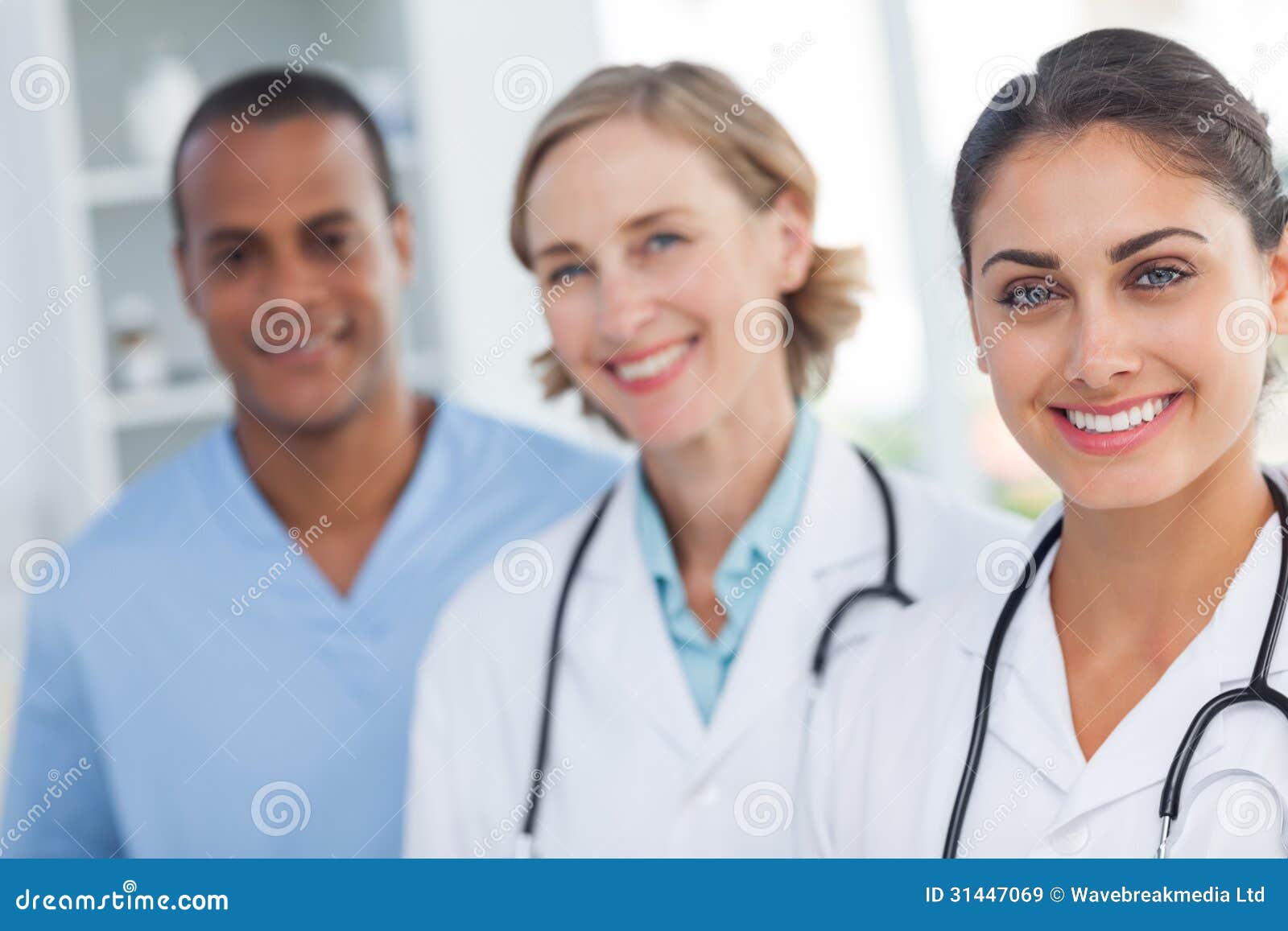 Three Smiling Doctors Looking at the Camera Stock Image - Image of ...
