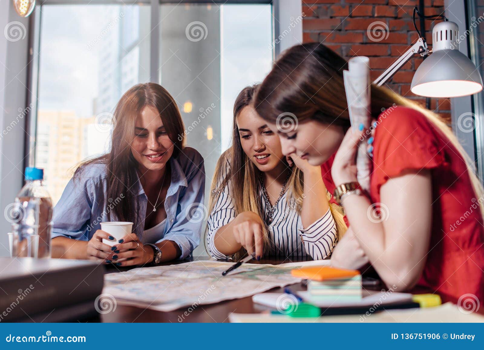 Three Smiling Female Students Learning Together in Classroom Stock ...