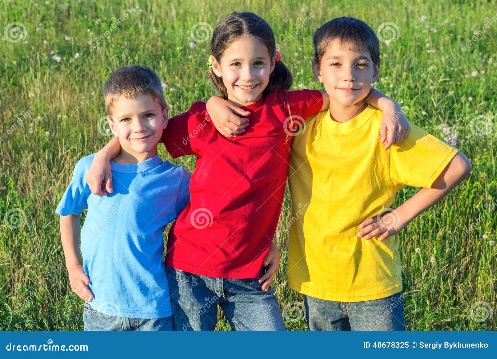 Three Smiling Kids on the Meadow Stock Image - Image of group ...