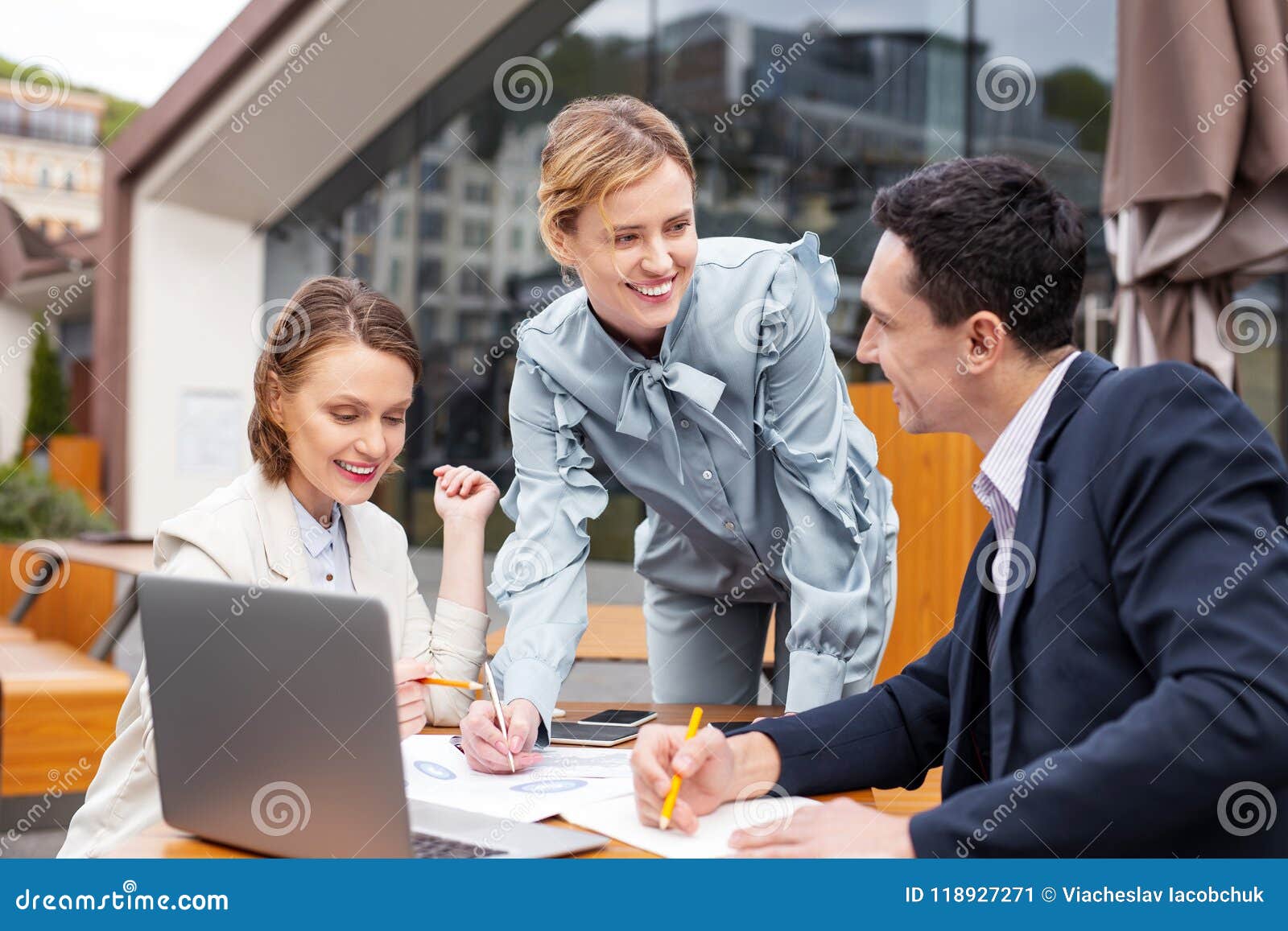 Three Smiling Leaders Enjoying Productive Teamwork Stock Image - Image ...