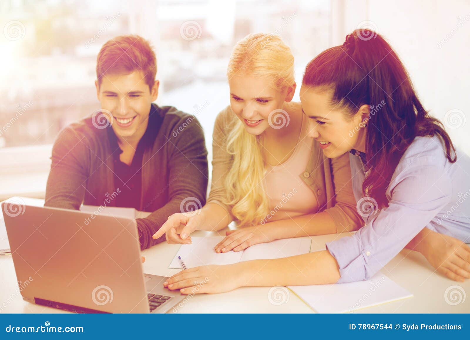 Three Smiling Students with Laptop and Notebooks Stock Photo - Image of ...