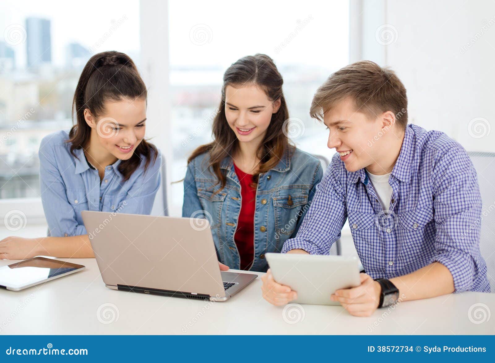 Three Smiling Students with Laptop and Tablet Pc Stock Photo - Image of ...