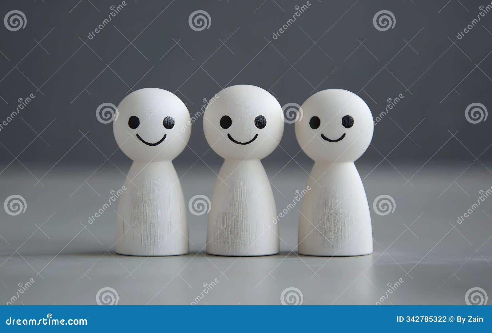 Three Smiling Wooden Figures Representing Happiness, Unity, Positivity ...