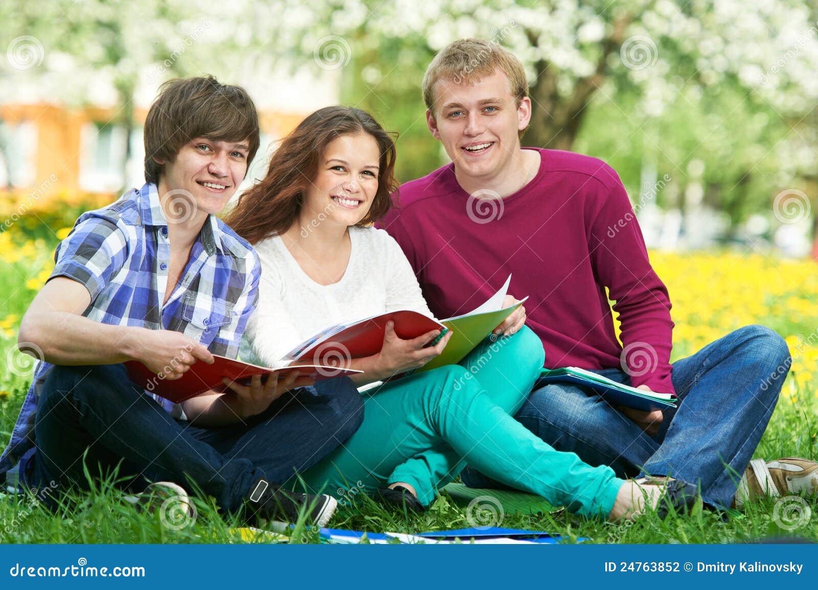Three Smiling Young Students Outdoors Stock Photo - Image of notebook ...