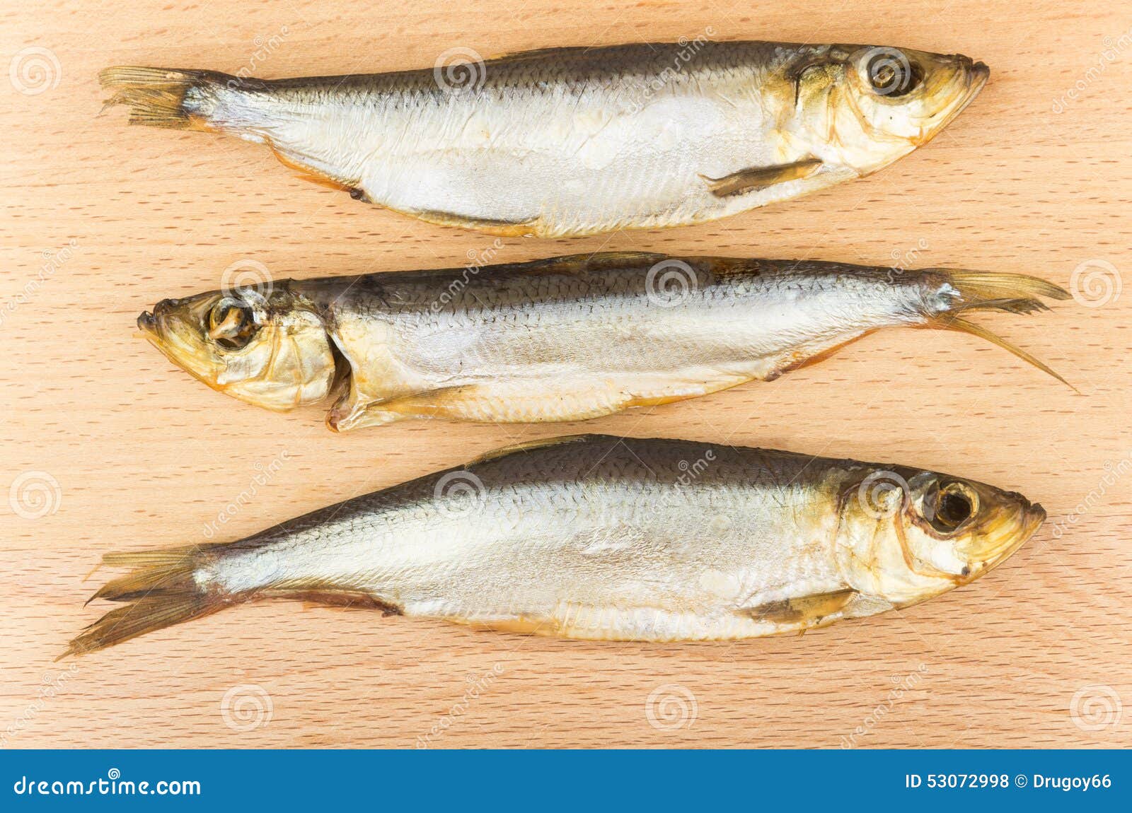 Three smoked fish on board stock photo. Image of kipper - 53072998