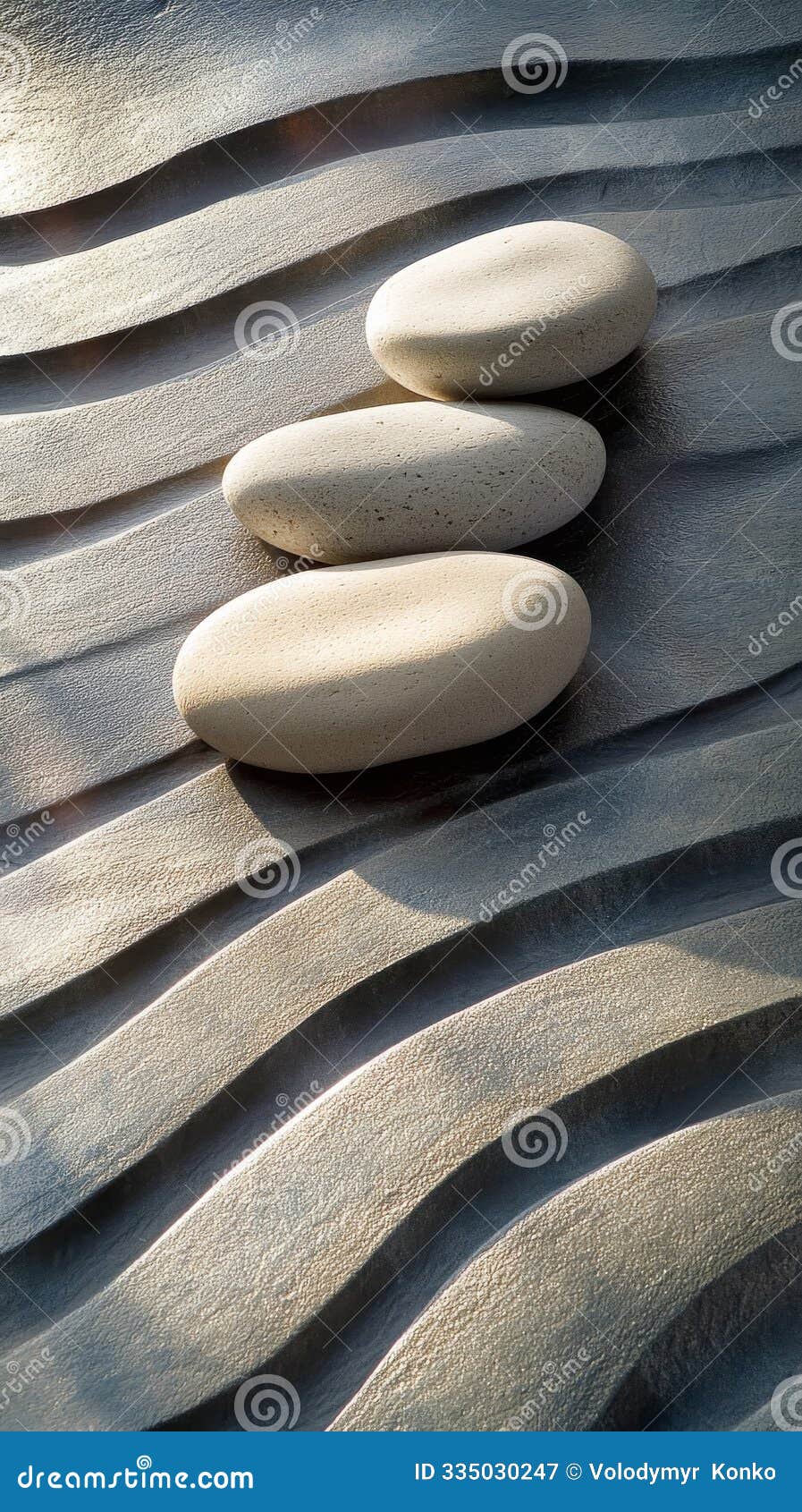 Three Smooth Basalt Stones Are Stacked Harmoniously Beside Delicate ...