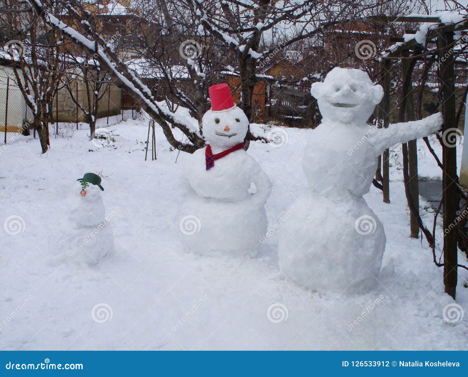 Three snowmen stock photo. Image of arch, growing, ground - 126533912