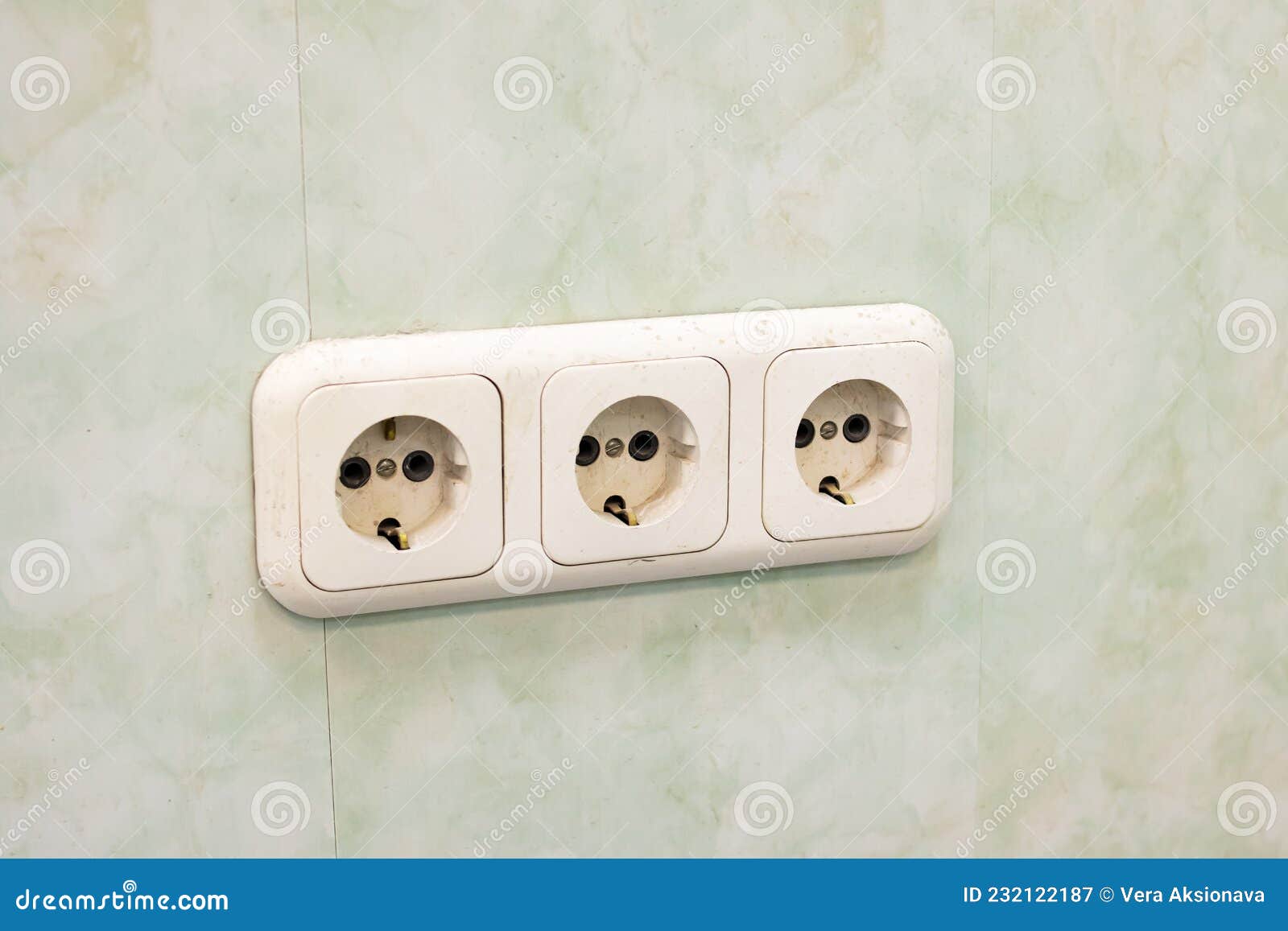 Three Sockets on a Green Wall Closeup Stock Image - Image of socket ...