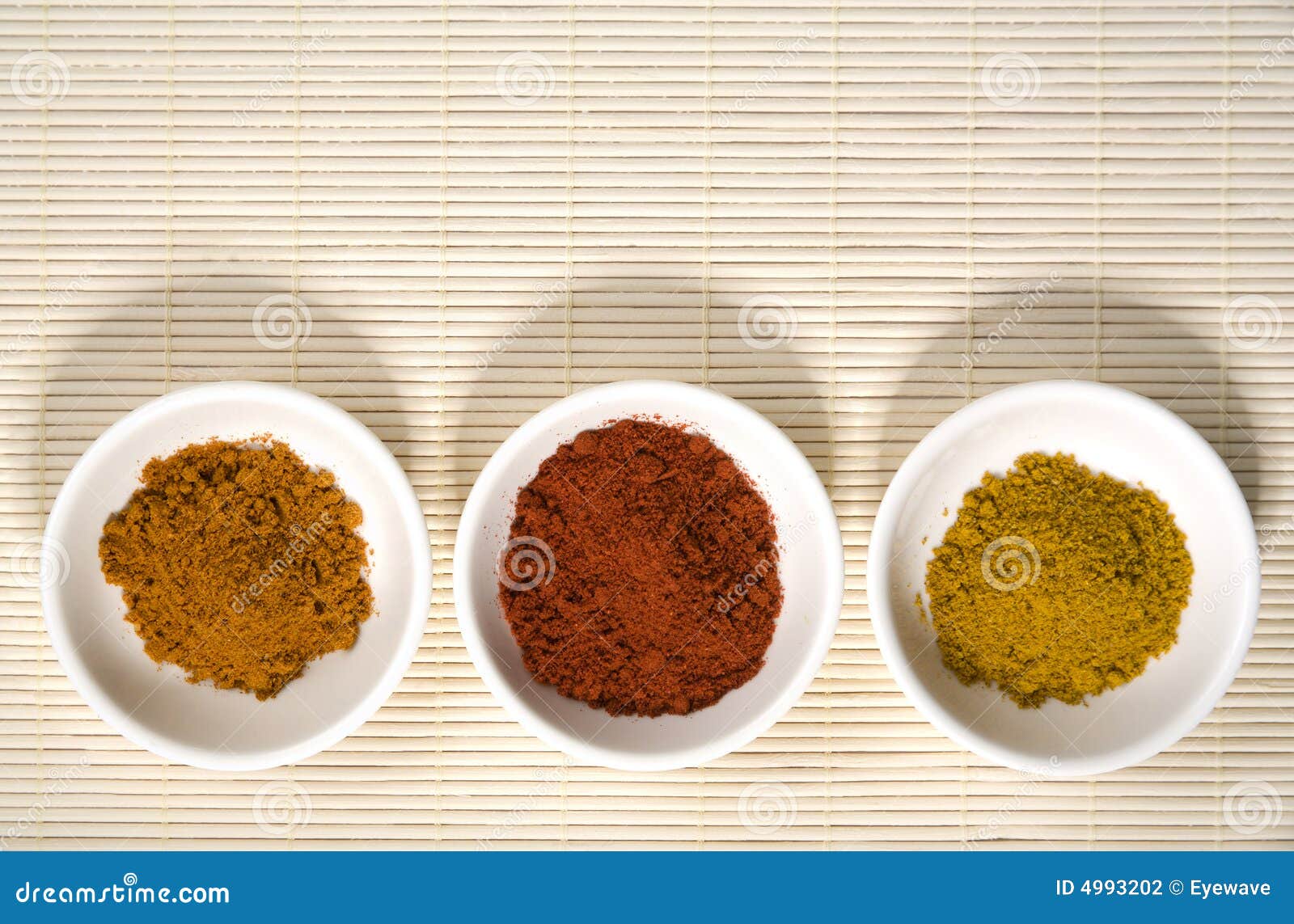 Three Spices in Bowls on Straw Mat Stock Photo - Image of straw, ground ...