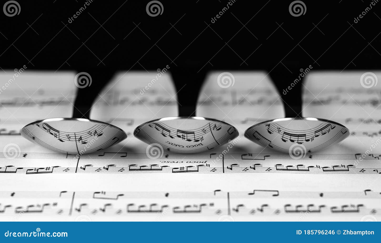 Three Spoons on a Sheet of Music Stock Photo - Image of musical, linear ...