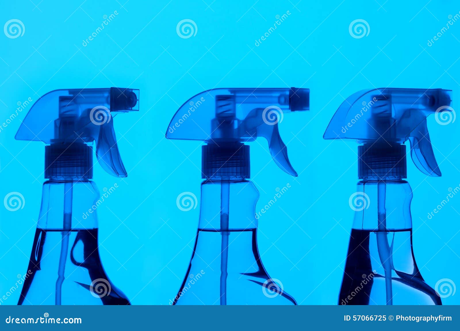 Three Spray Bottles with Blue Light Stock Image - Image of label ...