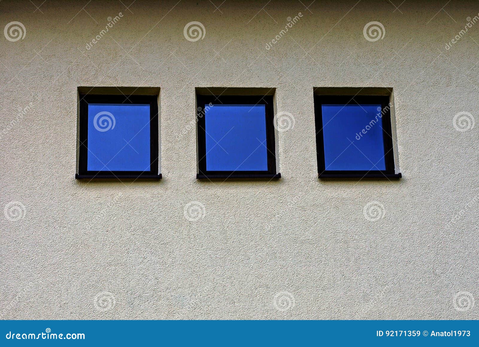 Three Square Small Windows on the Gray Wall of the Building Stock Image ...