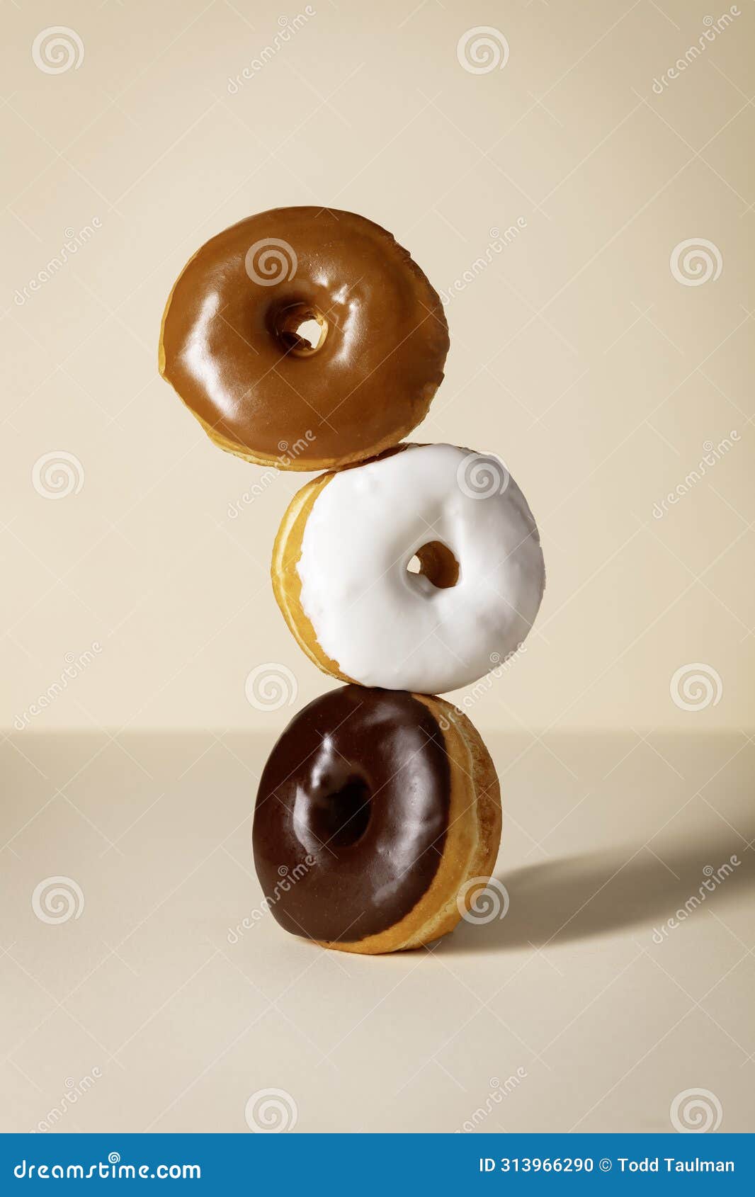 Three Stacked Glazed Donuts Stock Photo - Image of multiple, snack ...