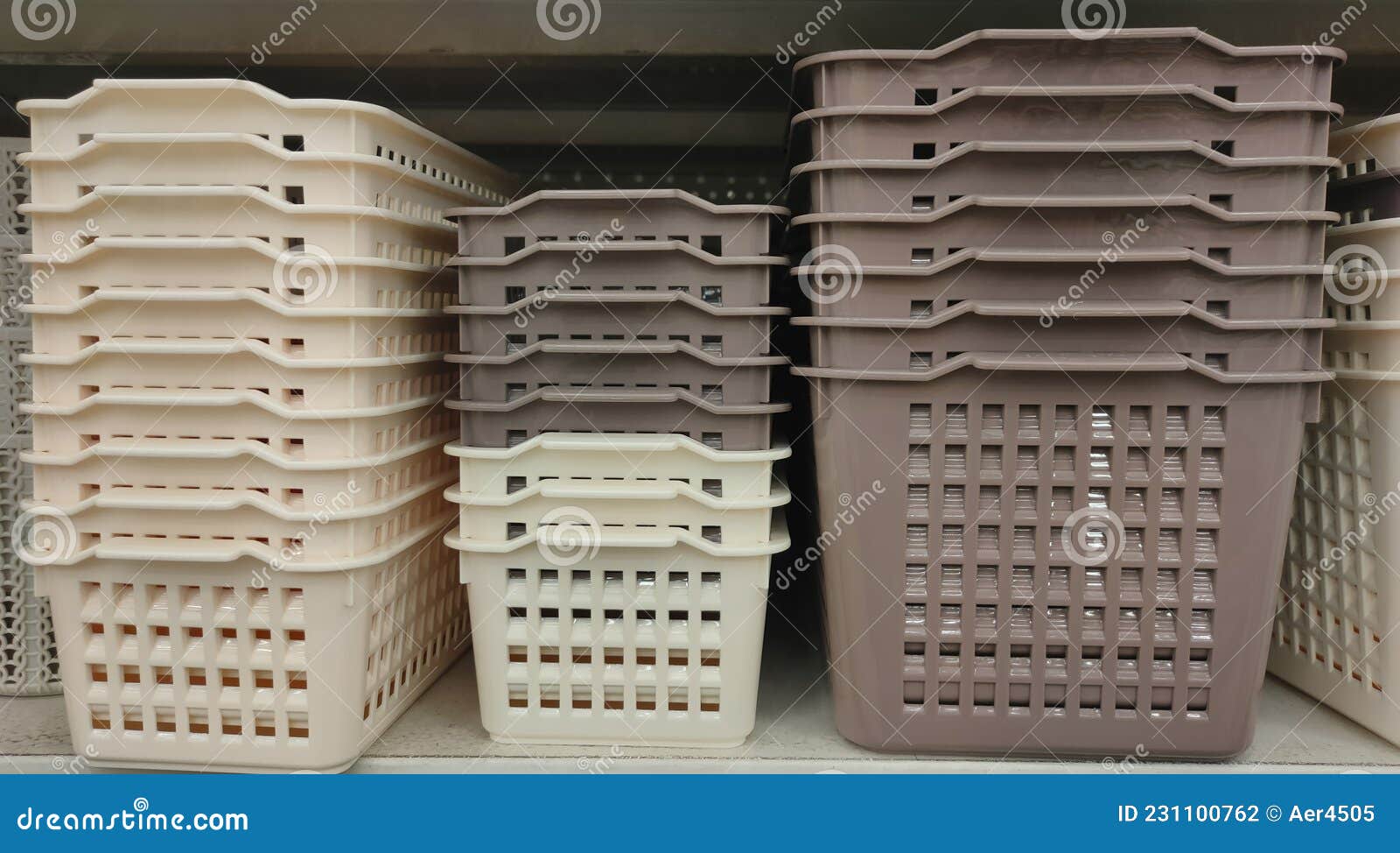 Three Stacks of Plastic Baskets on a Shelf for Storing Things Stock ...