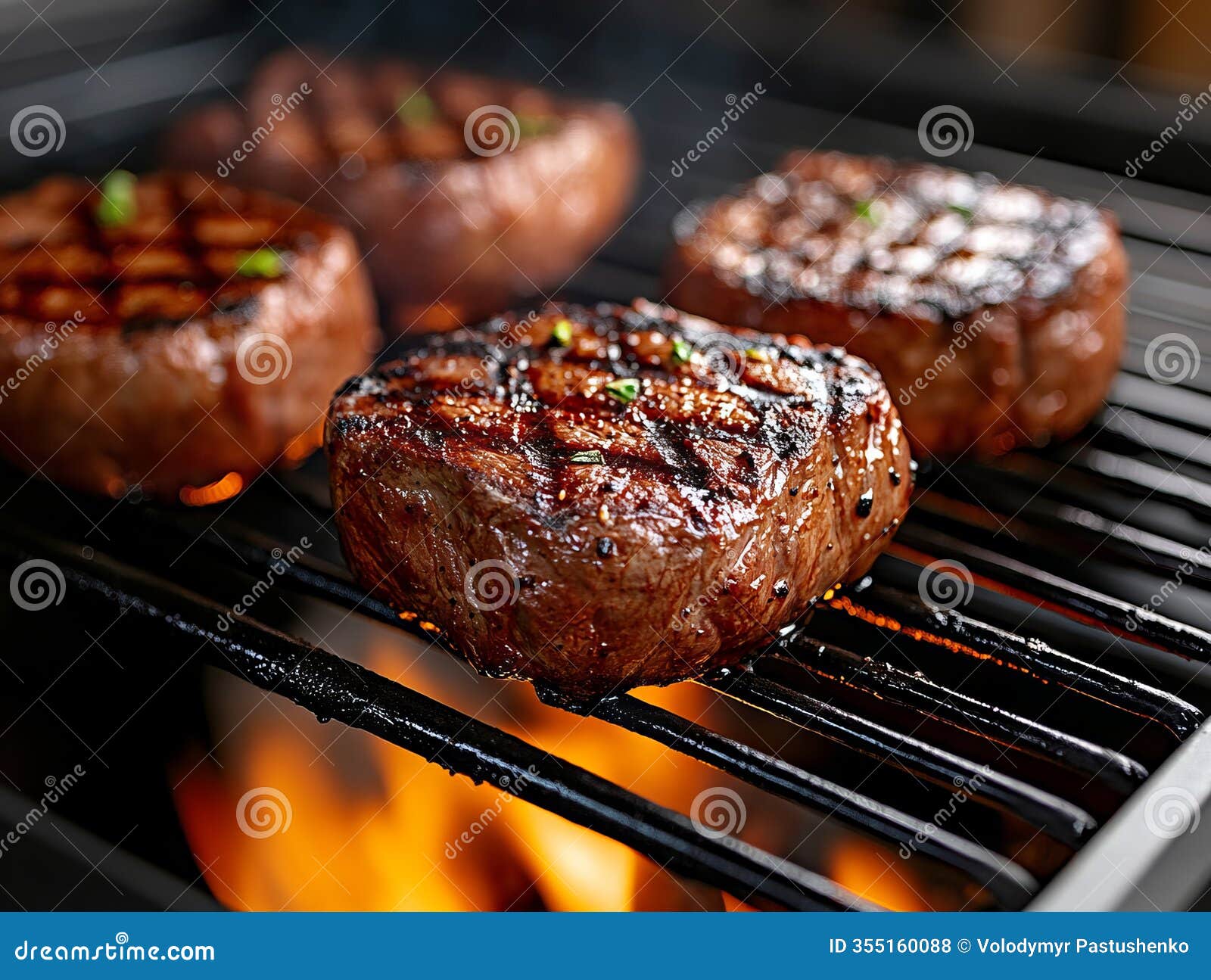Three Steaks Cooking on a Grill with Flames in the Background Stock ...