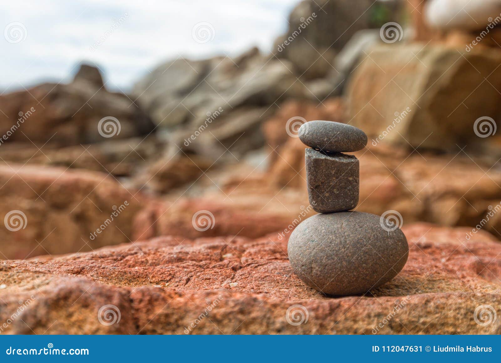 Three Stones in a Stack Near the Sea on the Beach. Ideological Concept ...
