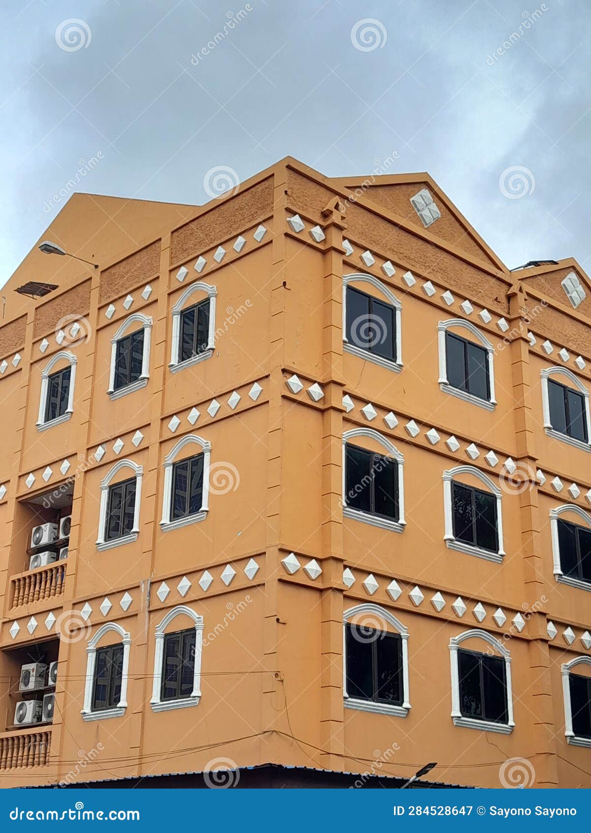 A Three-story Building with a Unique and Iconic Design, Which Looks ...