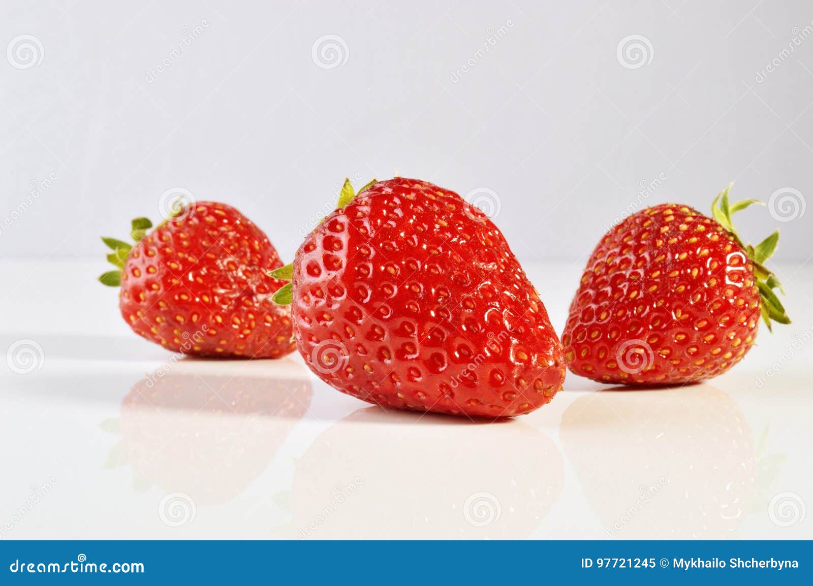 Three strawberries. stock image. Image of leaf, fruit - 97721245