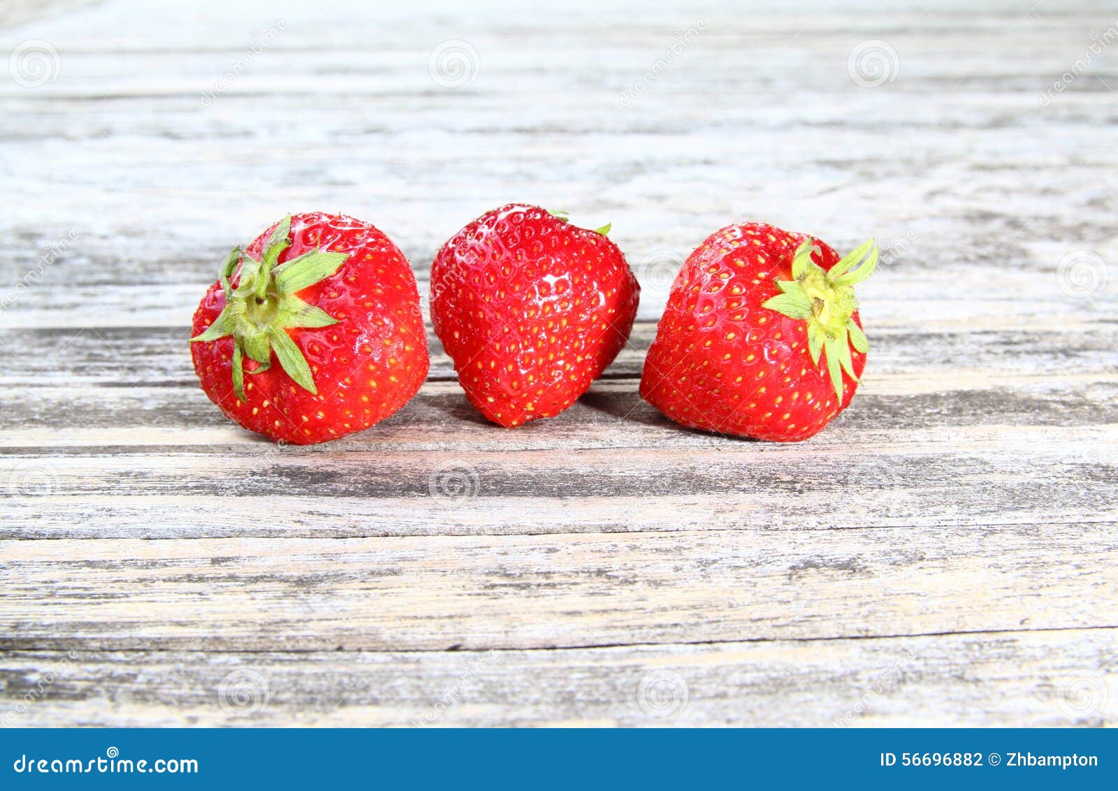 Three Strawberries on a Wooden Table Stock Photo - Image of healthy ...