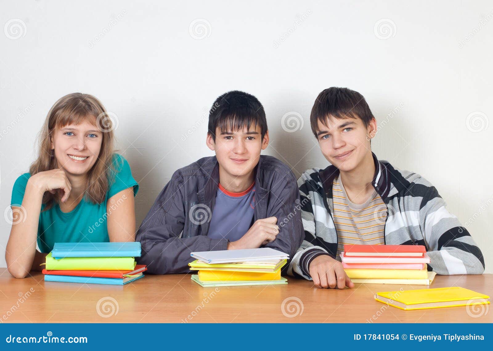 Three students with books stock photo. Image of friends - 17841054