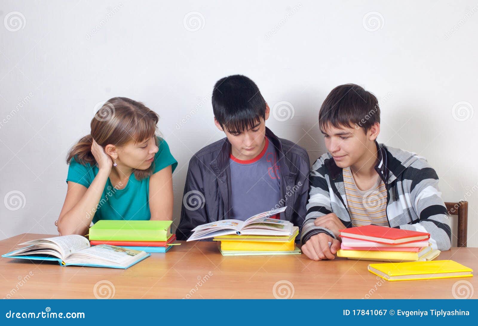 Three students with books stock image. Image of book - 17841067