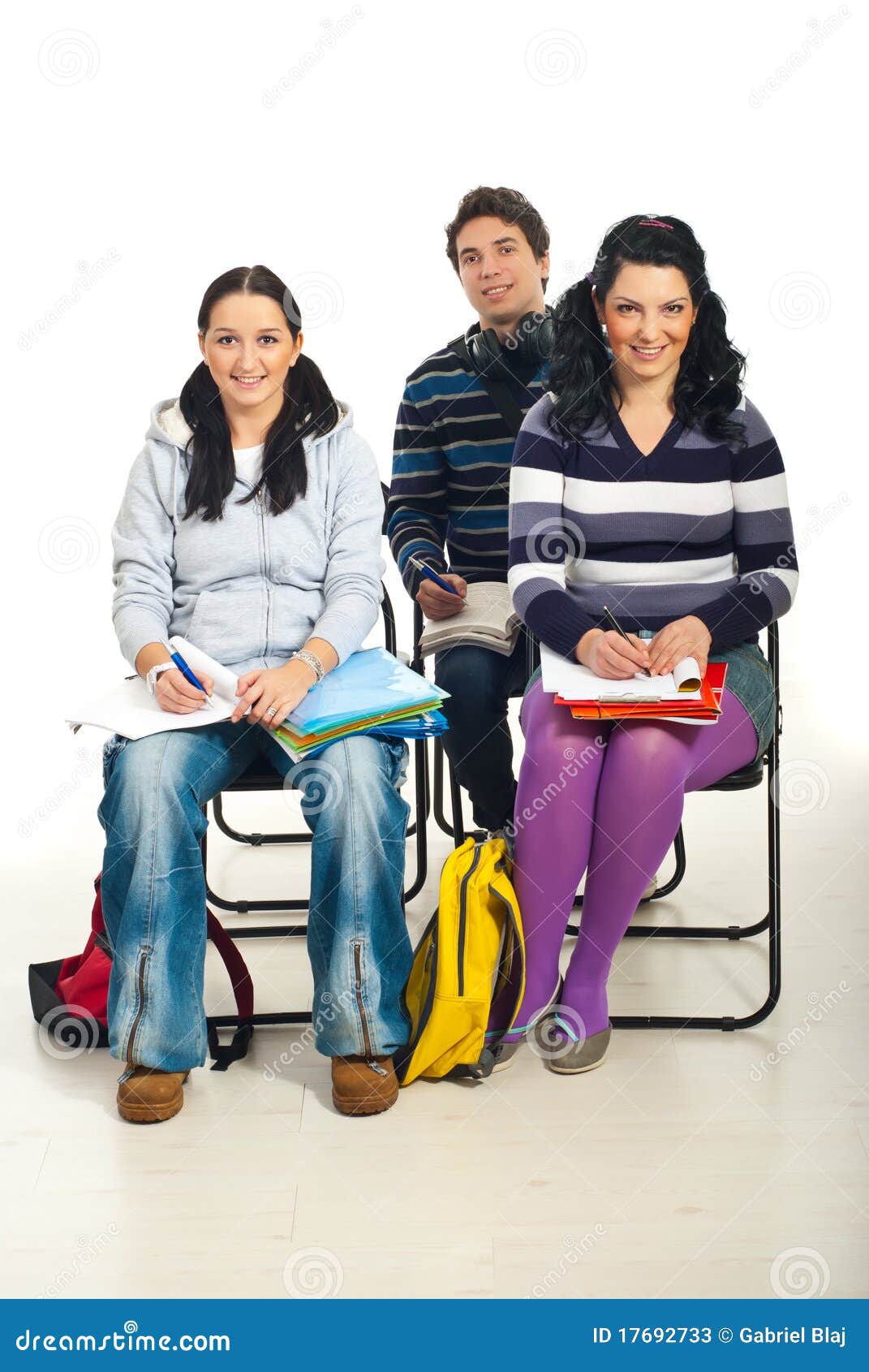 Three students on chairs stock image. Image of hold, full - 17692733
