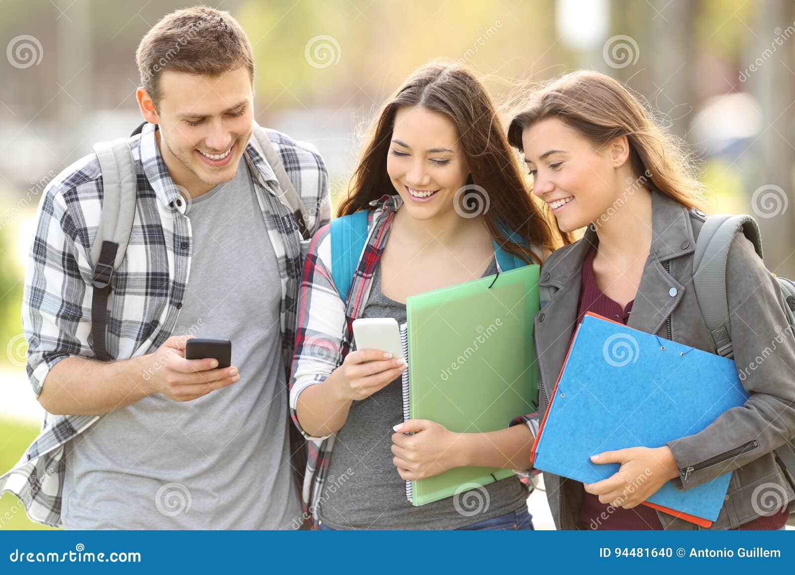 Three Students Checking Smart Phones Stock Photo - Image of happy ...