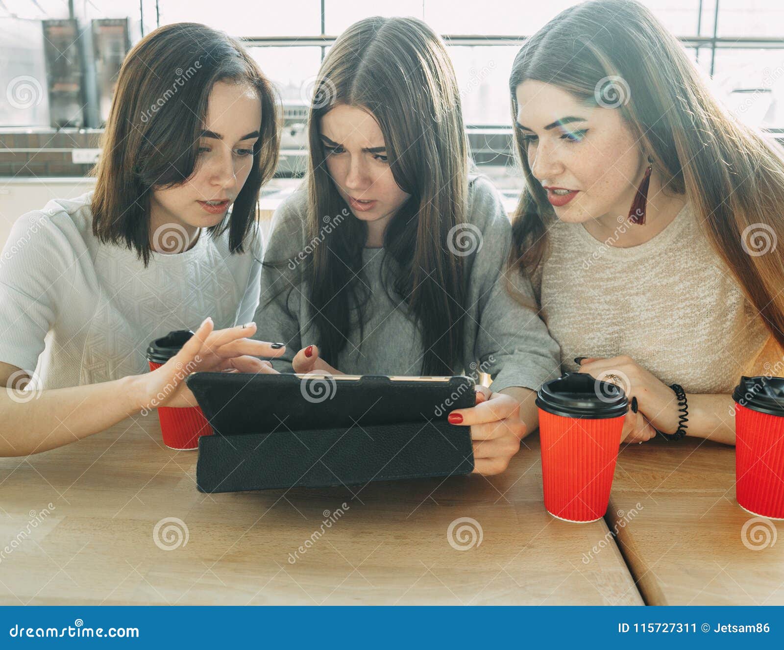 Three Students Discussing Project Using Tablet Stock Image - Image of ...