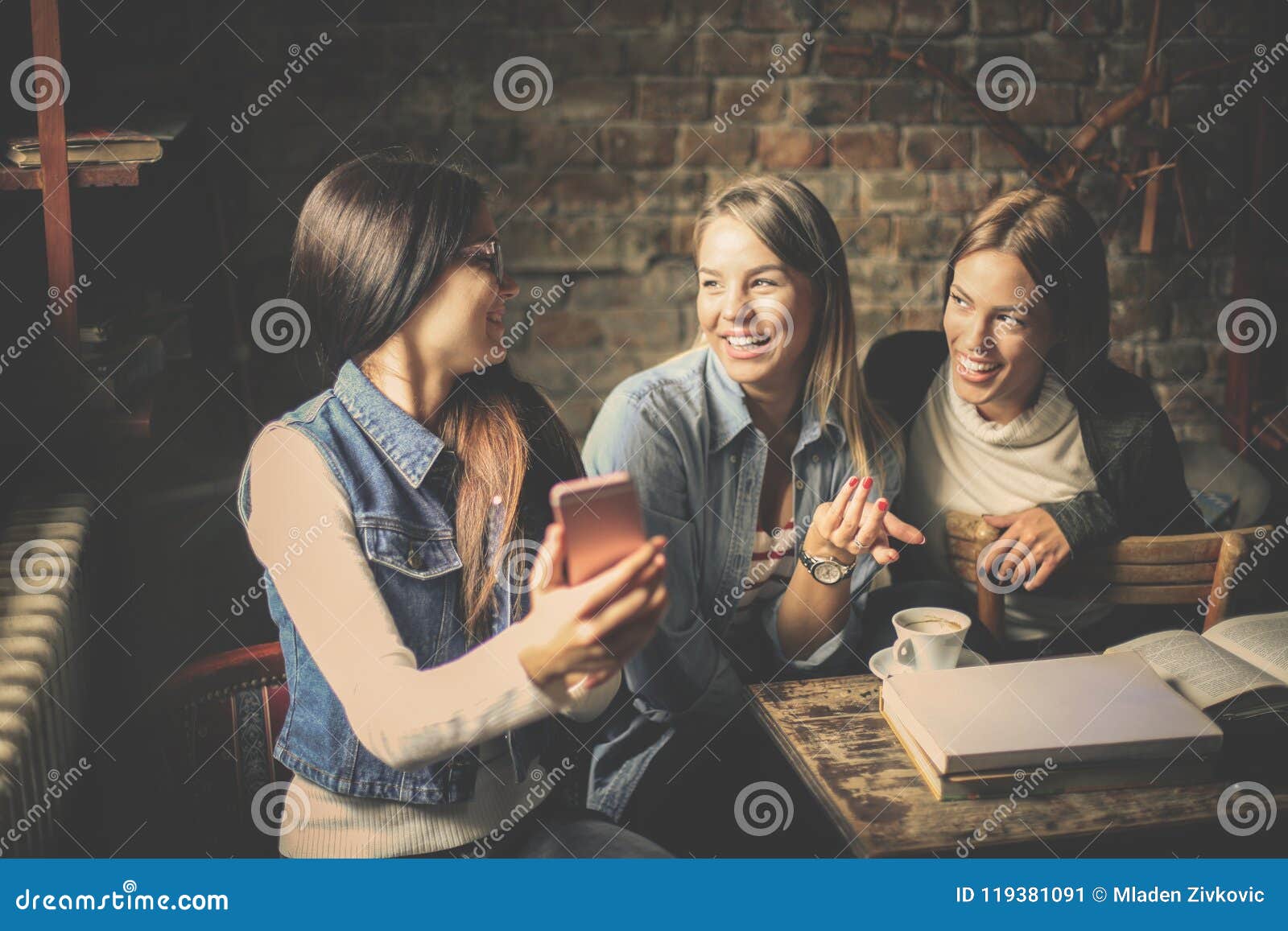 Three Students Girls Having Conversation and Using Smart Phone. Stock ...
