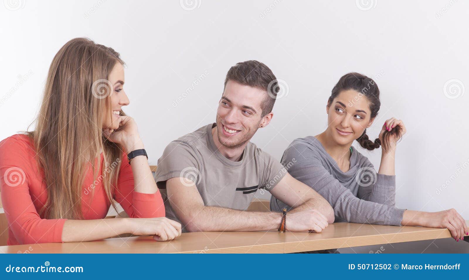 Three Students in Lecture Hall Stock Photo - Image of college, evening ...