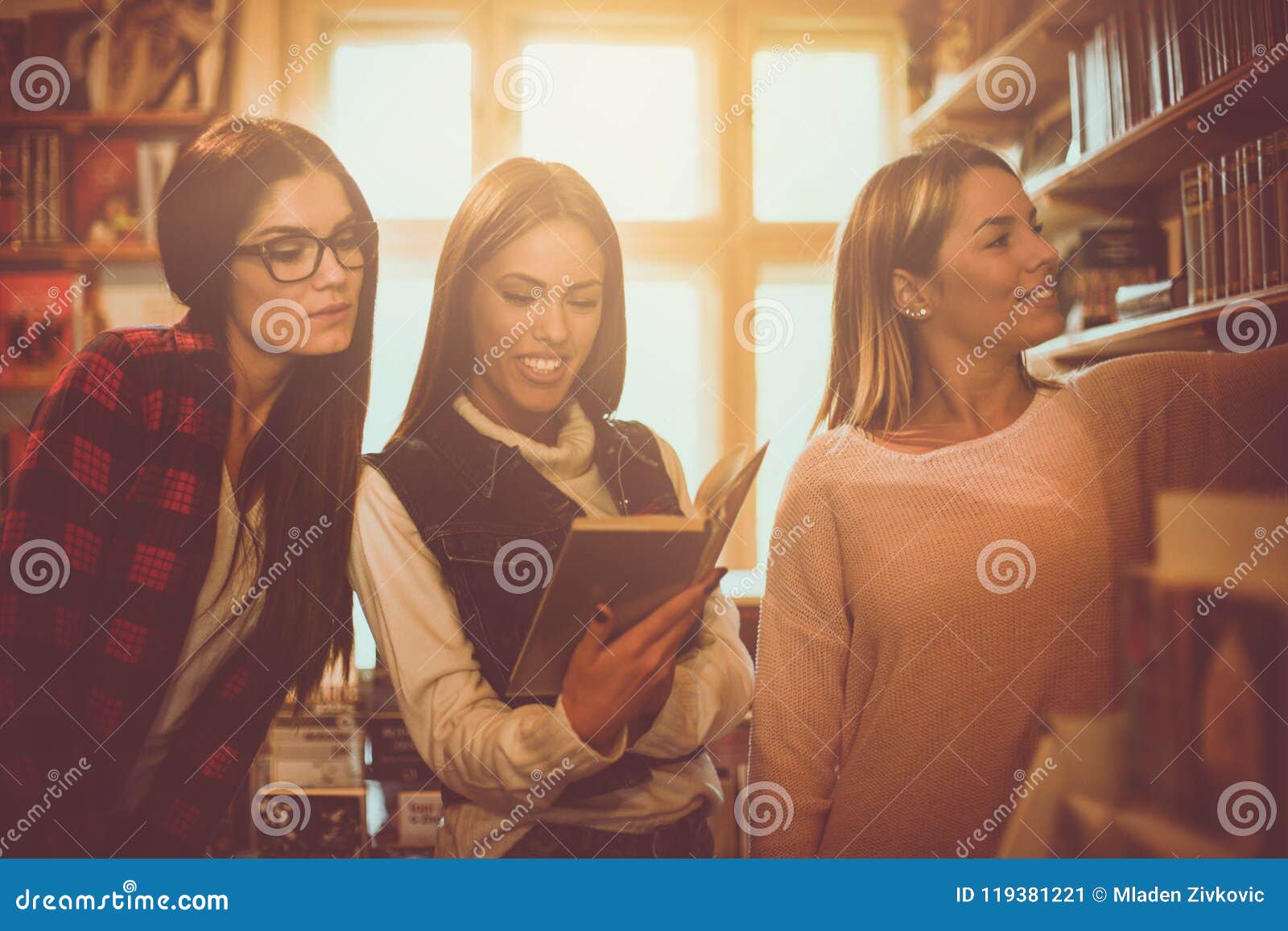 Three Students in Library Together. Stock Image - Image of females ...