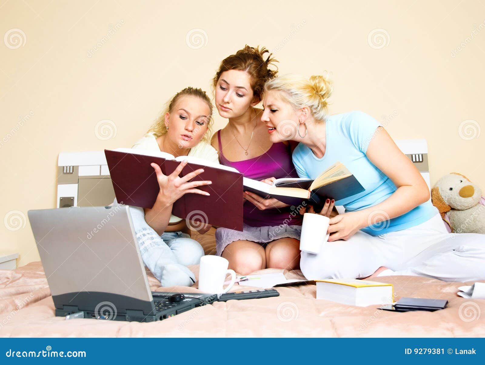 Three Students Reading a Book Stock Image - Image of attractive, room ...