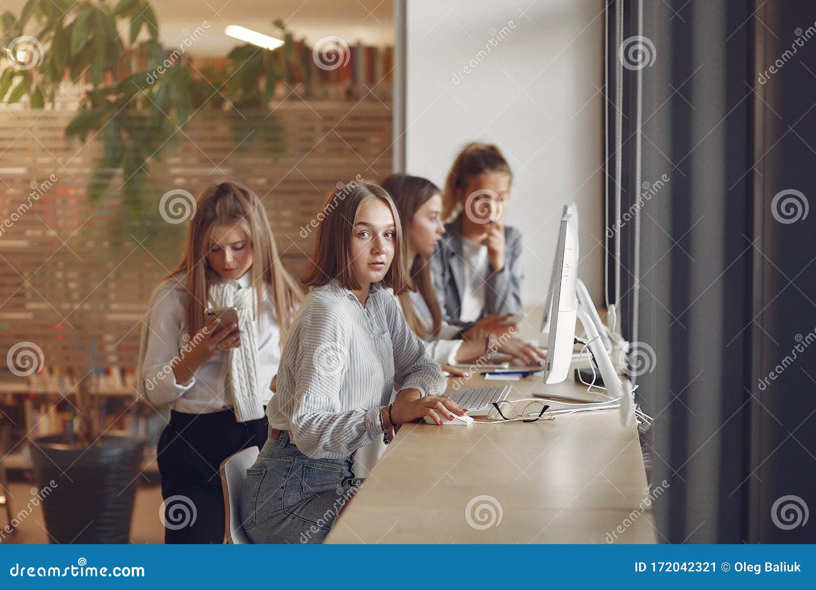 Three Students Sitting at the Table in a Class Stock Image - Image of ...