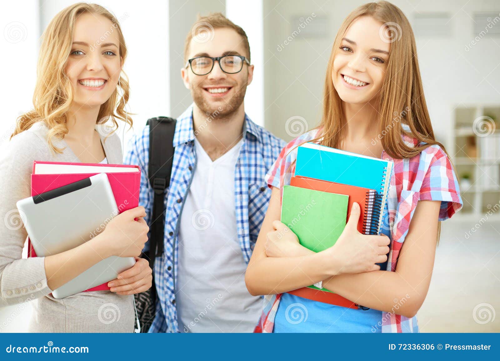 Three students stock photo. Image of college, looking - 72336306