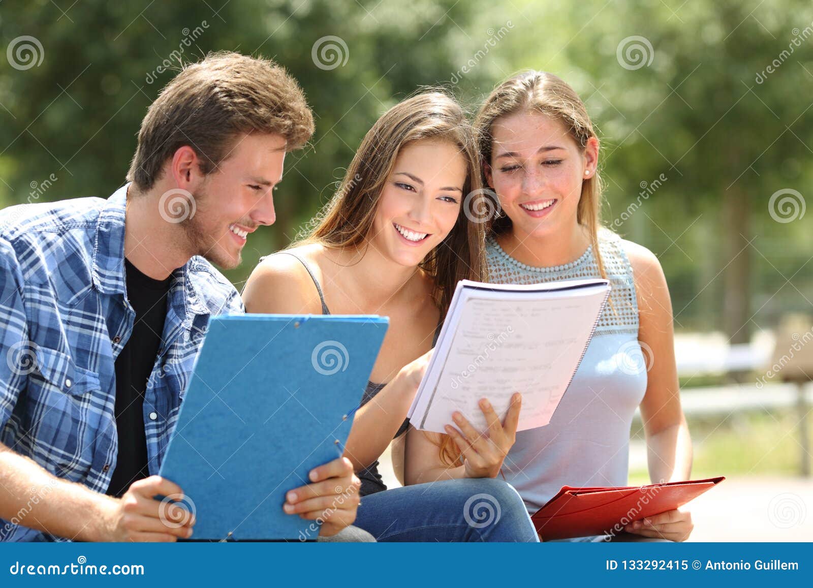 Three Students Studying Together in a Campus Park Stock Image - Image ...
