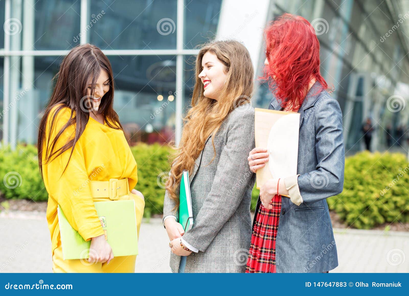 Three Students Talk and Laugh at the University. Education Concept ...